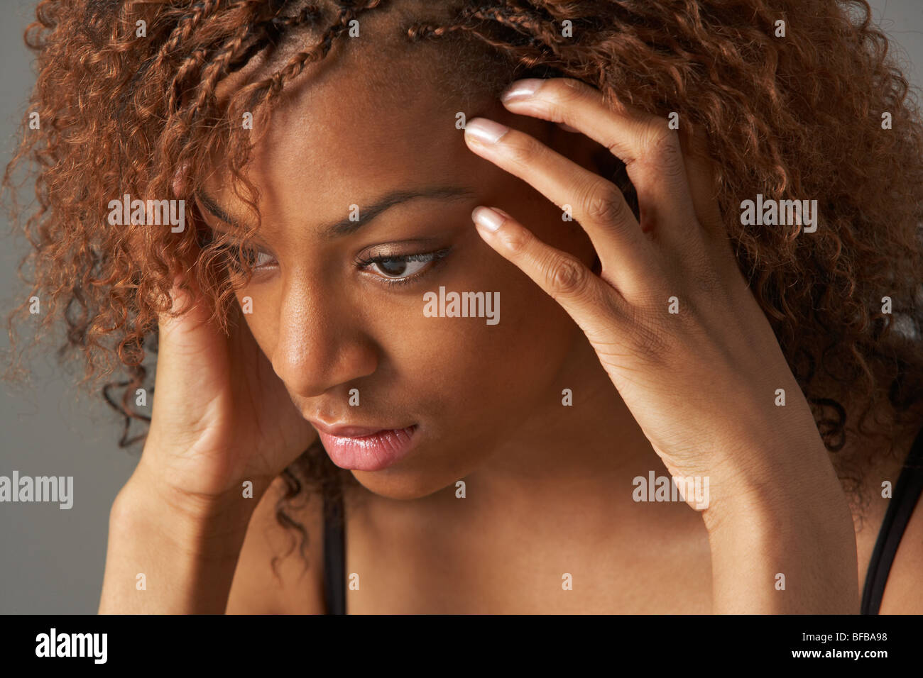Studio Portrait Of Stressed Teenage Girl Stock Photo - Alamy