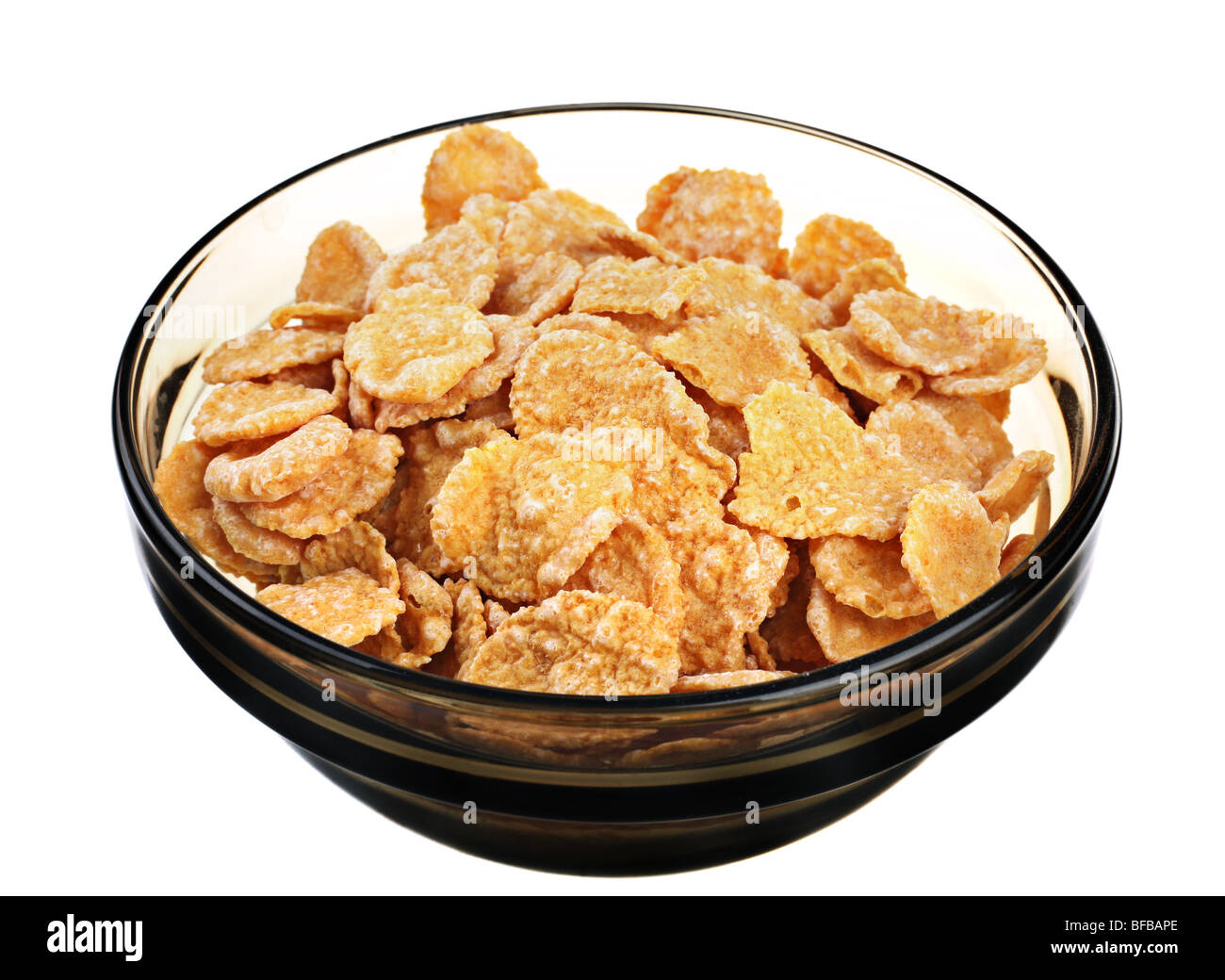 Flake corn in glass plate on white background Stock Photo - Alamy