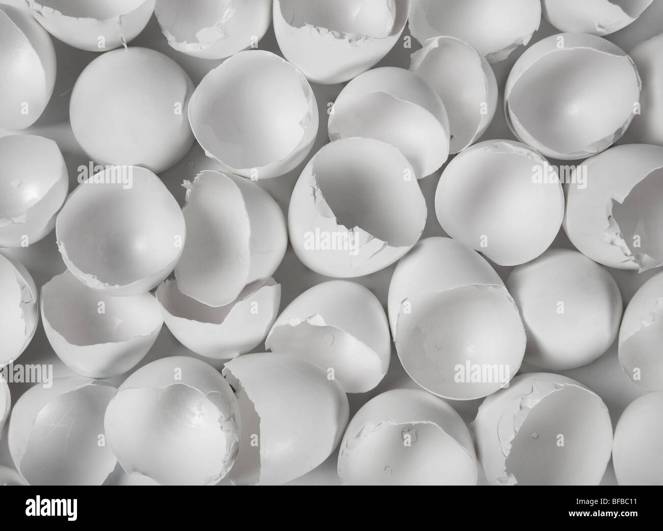 White egg broken shell closeup background Stock Photo - Alamy