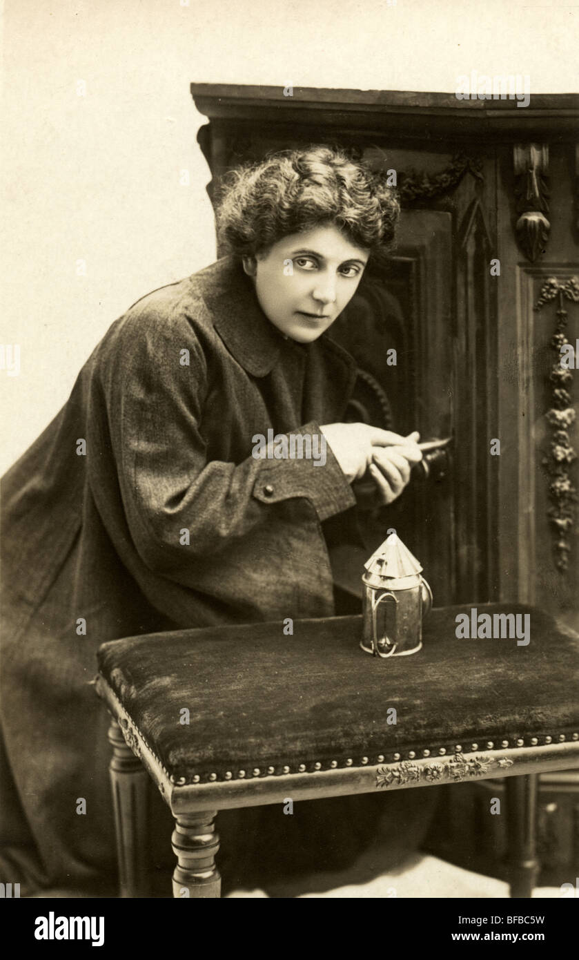 Female Thief Burglarizing a Safe Stock Photo - Alamy