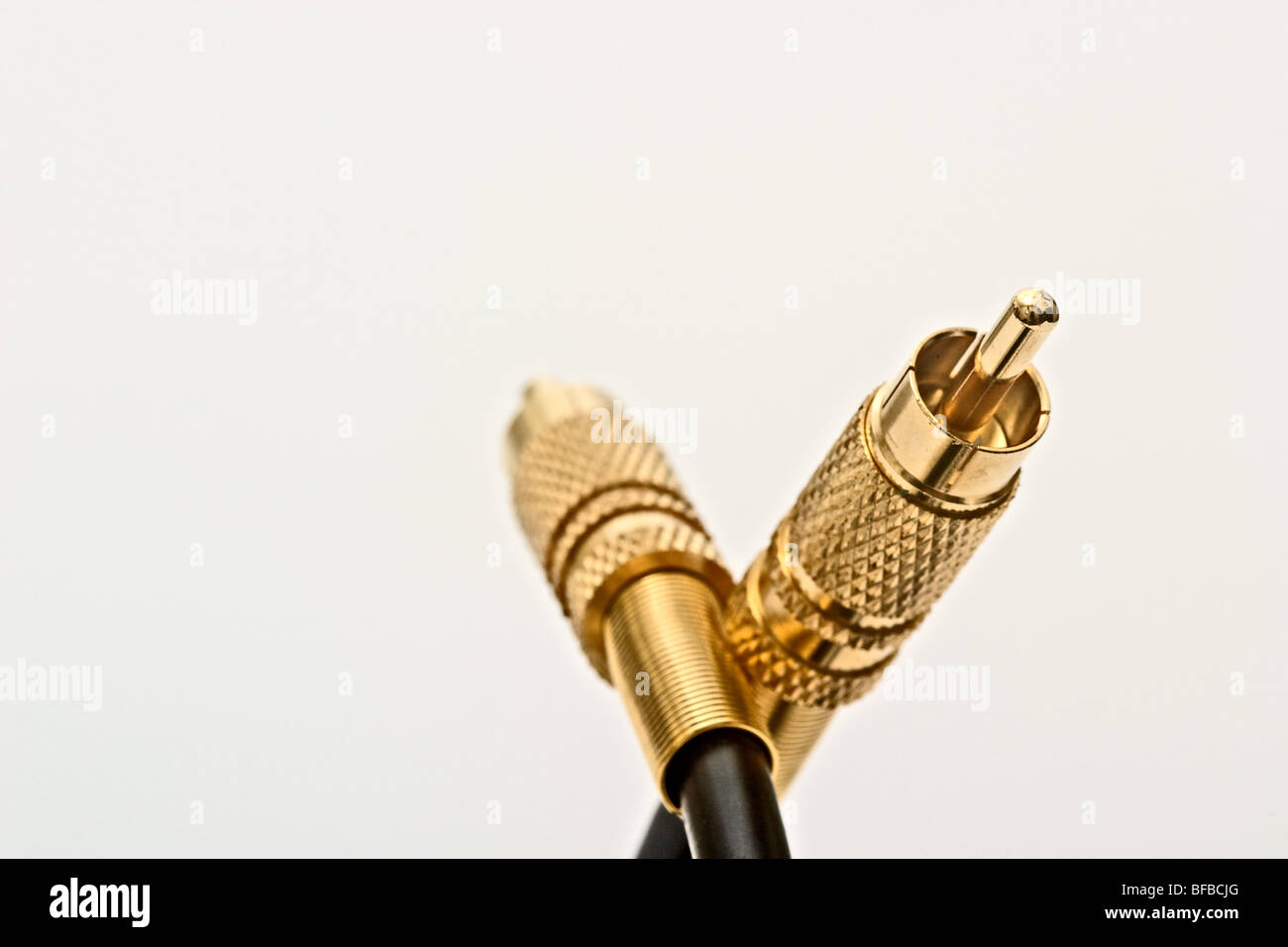 Gold connectors attached to wires Stock Photo - Alamy