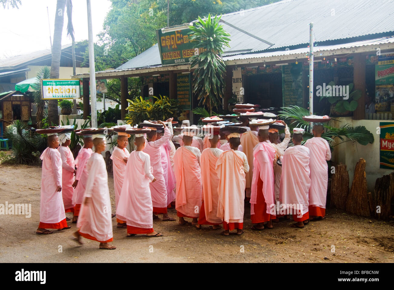 Nuns collecting food in Nyaung U, Bagan Stock Photo - Alamy