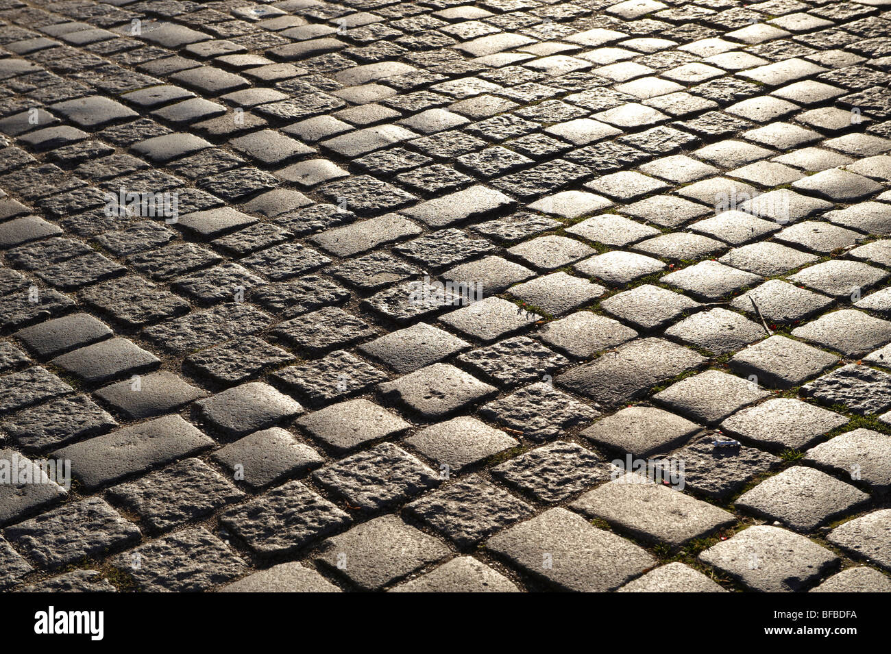 Urban textures - reflections on cobbled street Stock Photo - Alamy