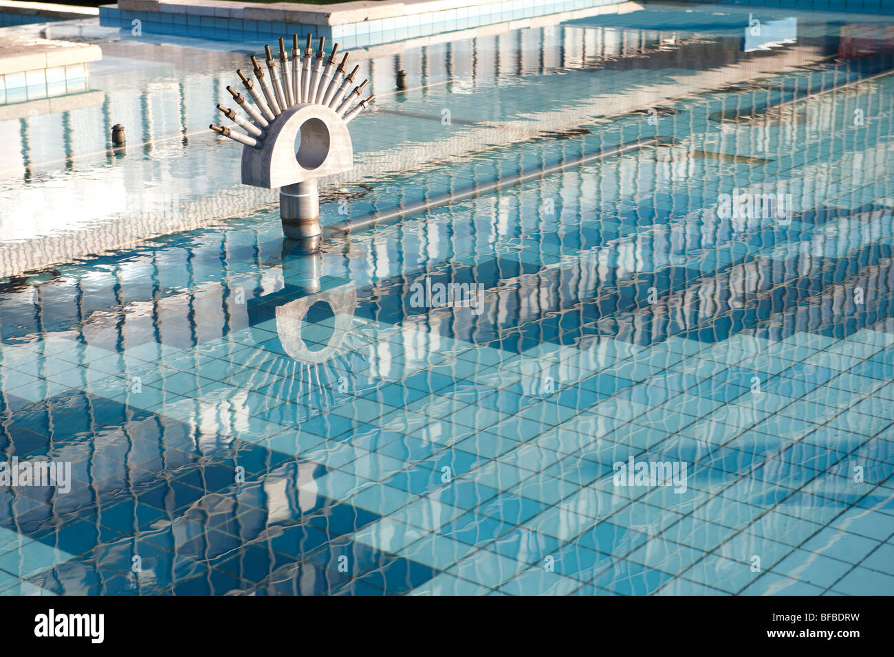 Urban textures - reflections in water with blue tiles Stock Photo - Alamy
