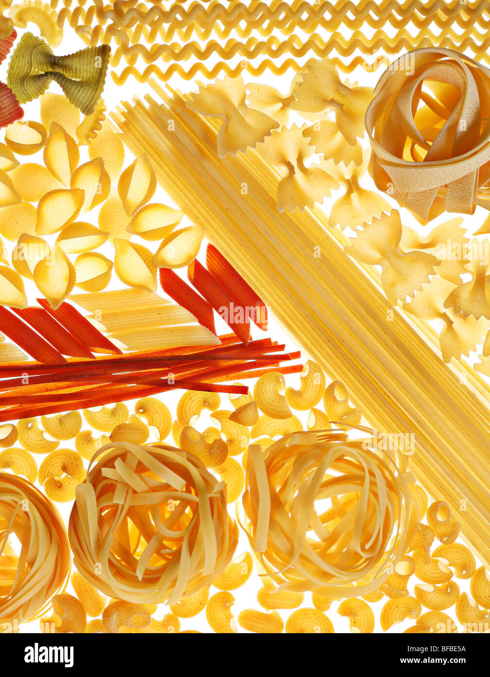 Raw color pasta mix closeup background Stock Photo - Alamy