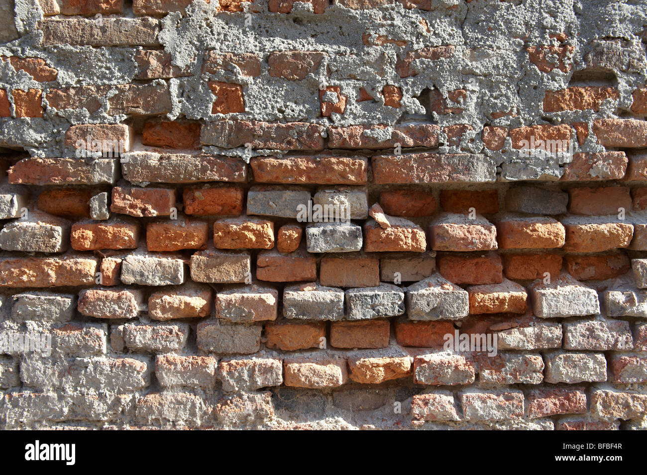 Close up of old red brick wall with damaged bricks, urban textures ...