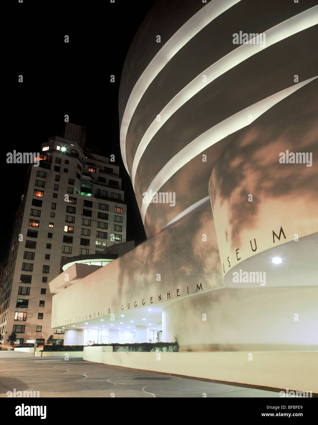 Street lights cast shadows of trees on the Guggenheim Museum (designed ...