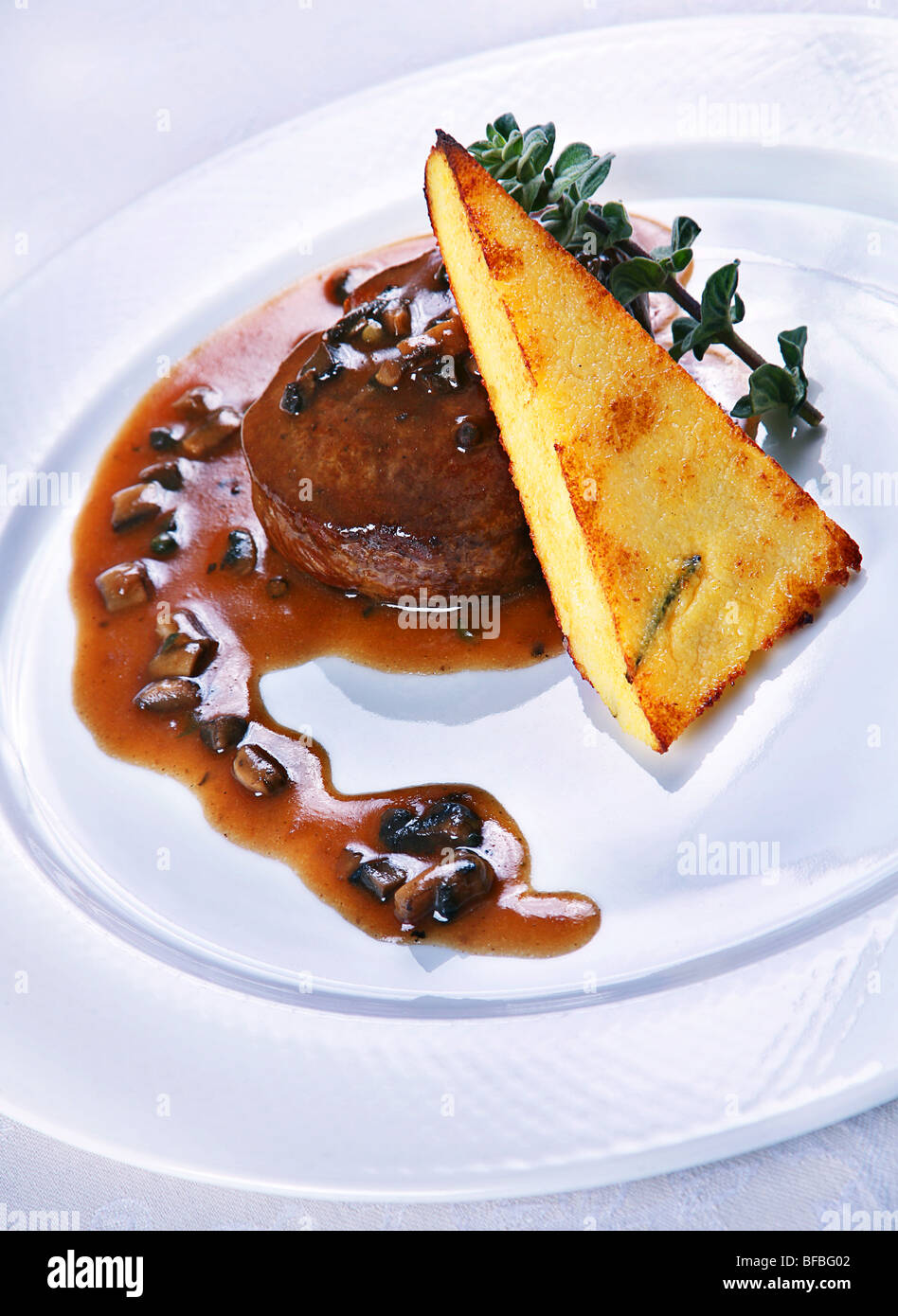 Fried meat stake with mushroom sauce Stock Photo - Alamy