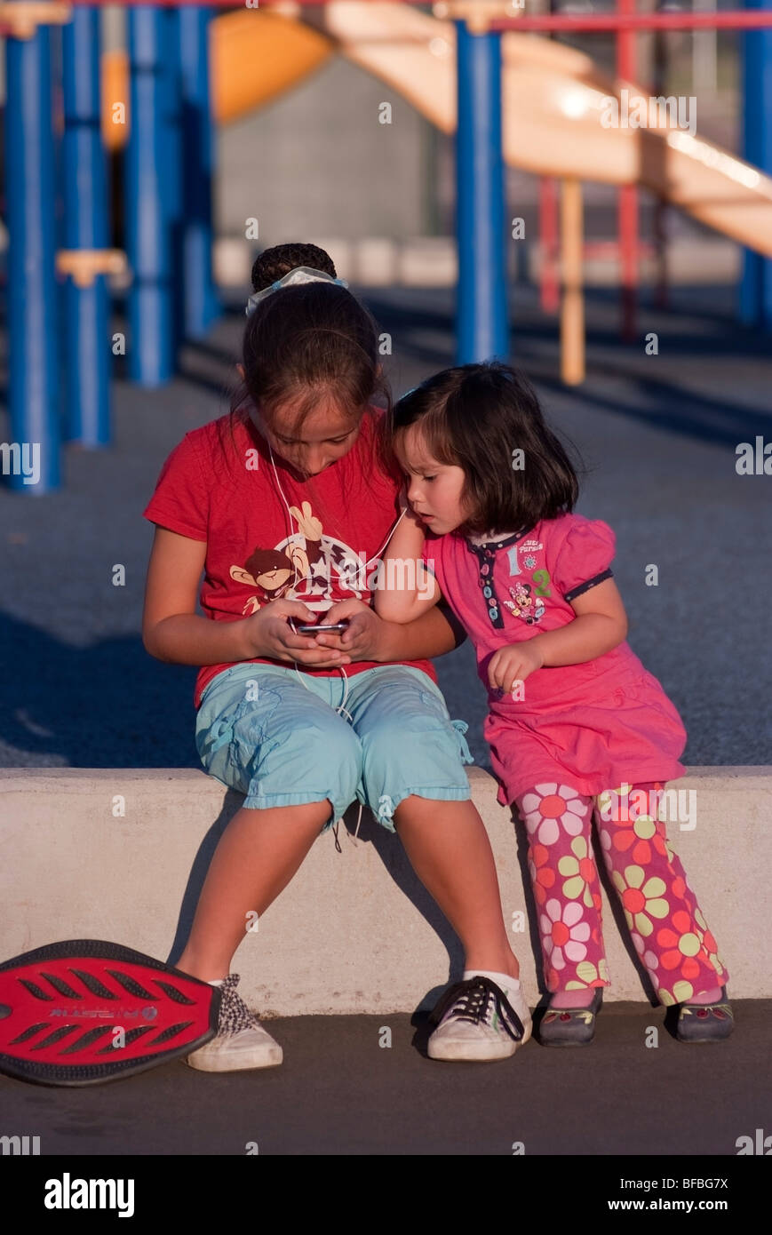 11 Year Old Girl Listens To An Ipod Next To Her 2 Year Old Sister In