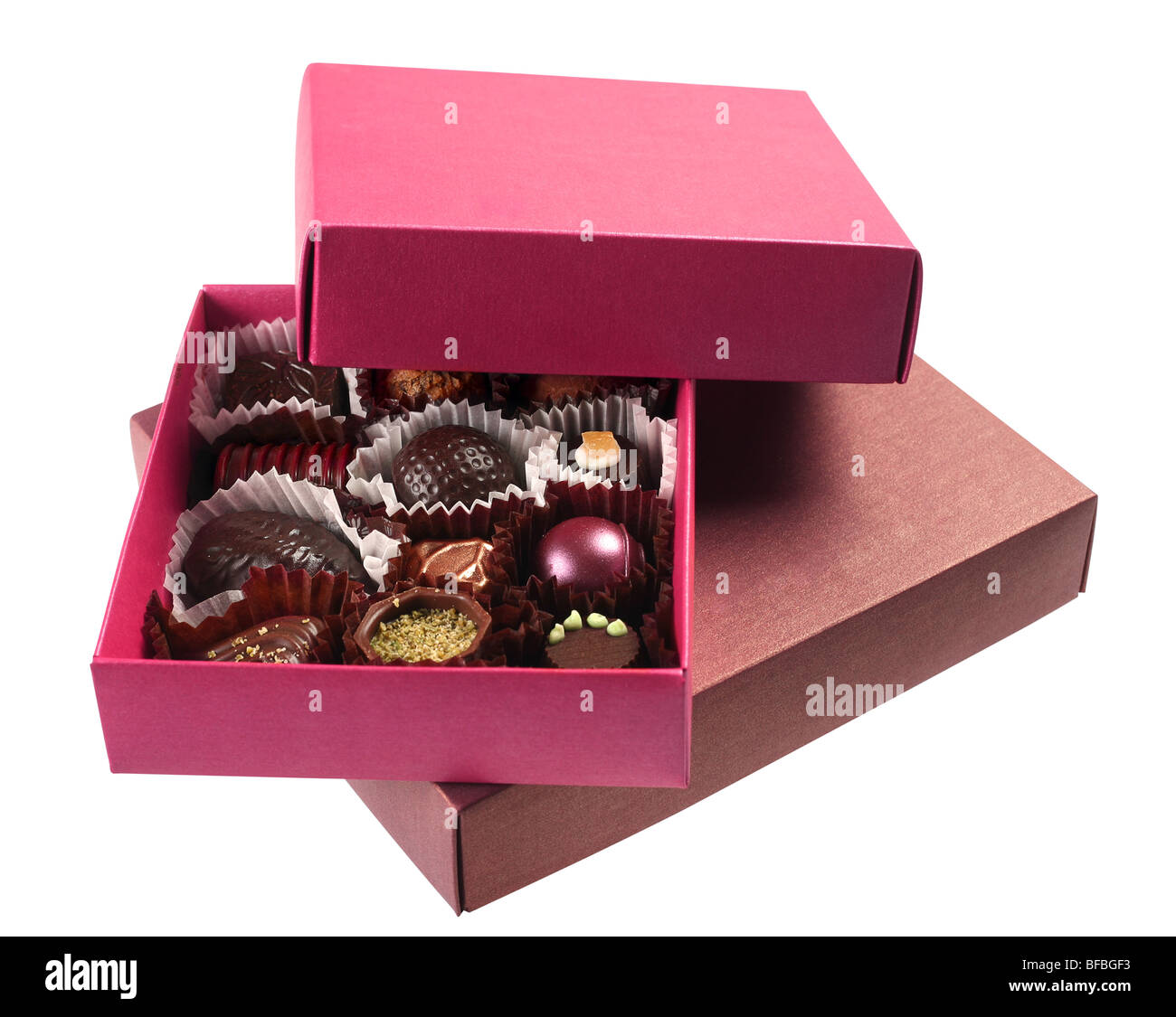 Chocolate candy group in purple box on white Stock Photo - Alamy