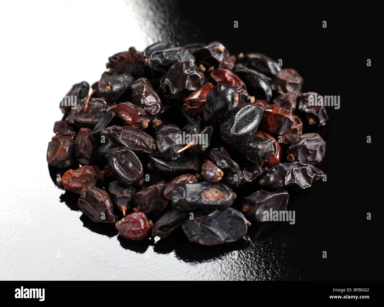 Barberry spice round heap closeup on black white background Stock Photo ...