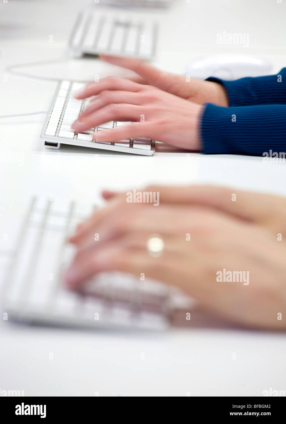Hands typing on computer keyboard Stock Photo - Alamy