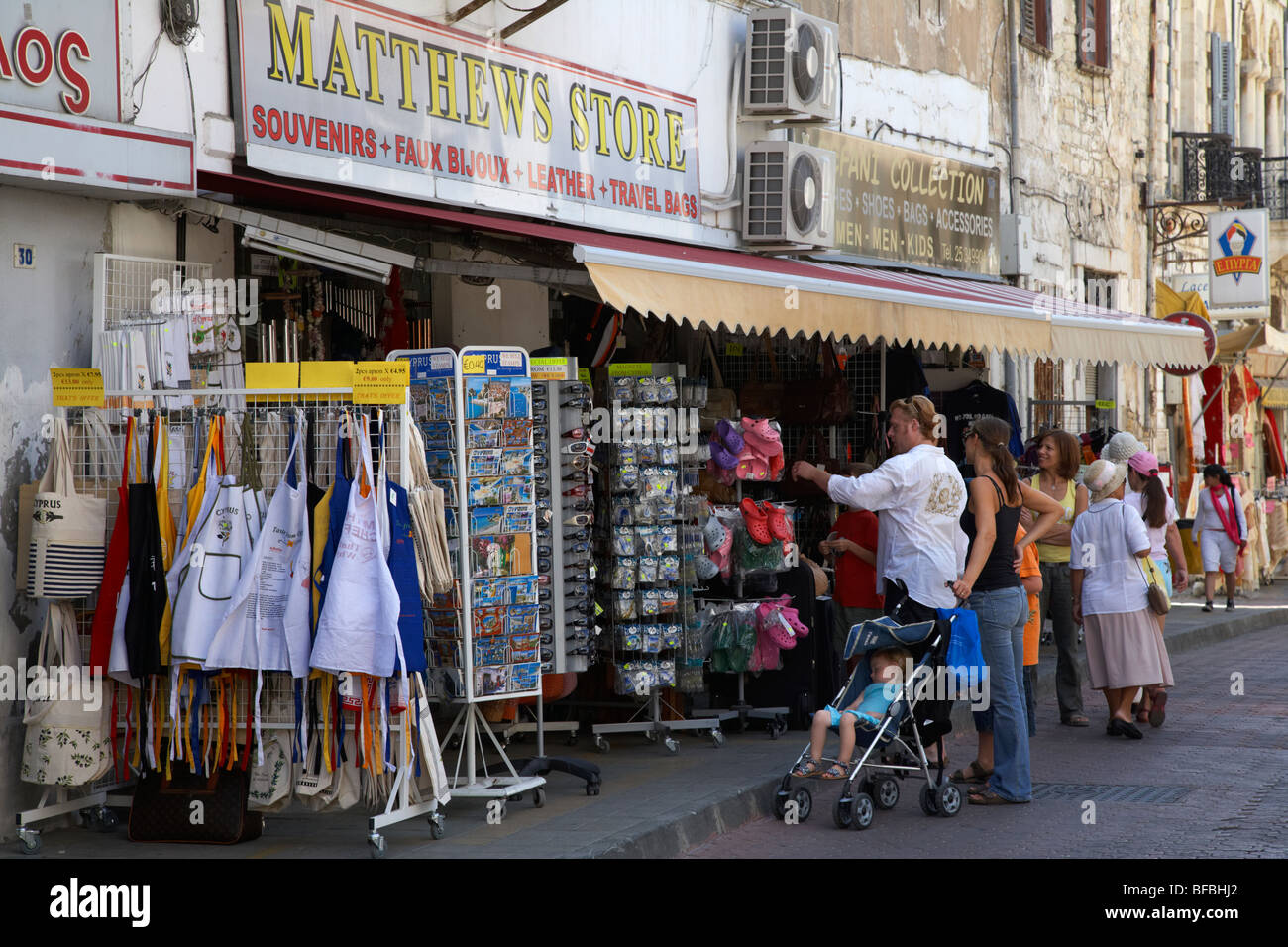 tourists shopping in souvenir shops in the old town Limassol lemesos ...