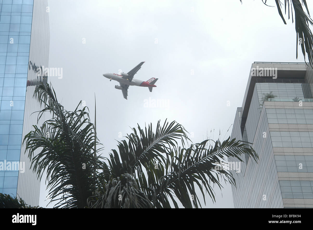 Plane flying over a building in São Paulo, Brazil. 23/10/2009 at 08 ...