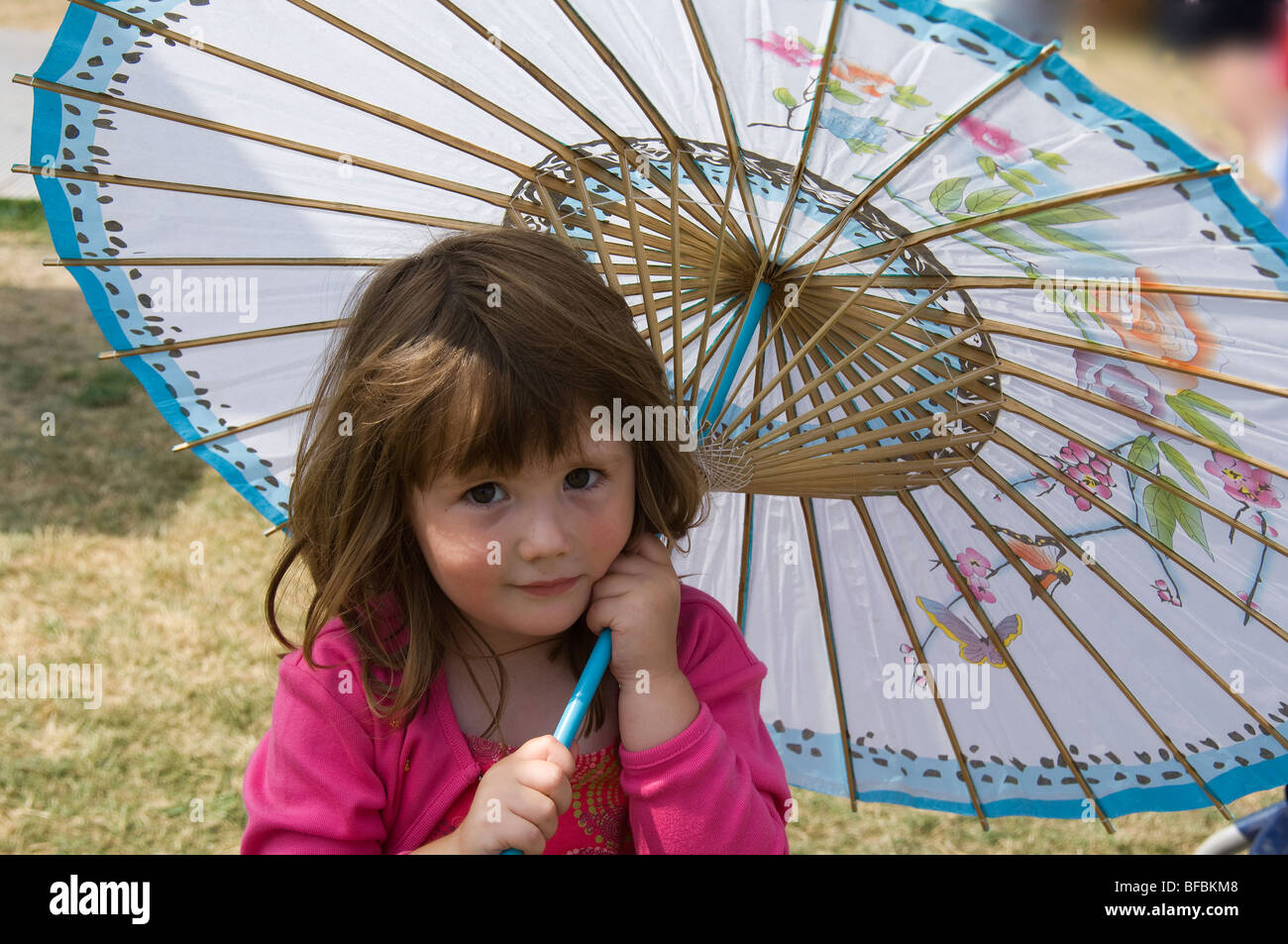 Girl with parasol, enjoying RHS Flower Show Stock Photo - Alamy