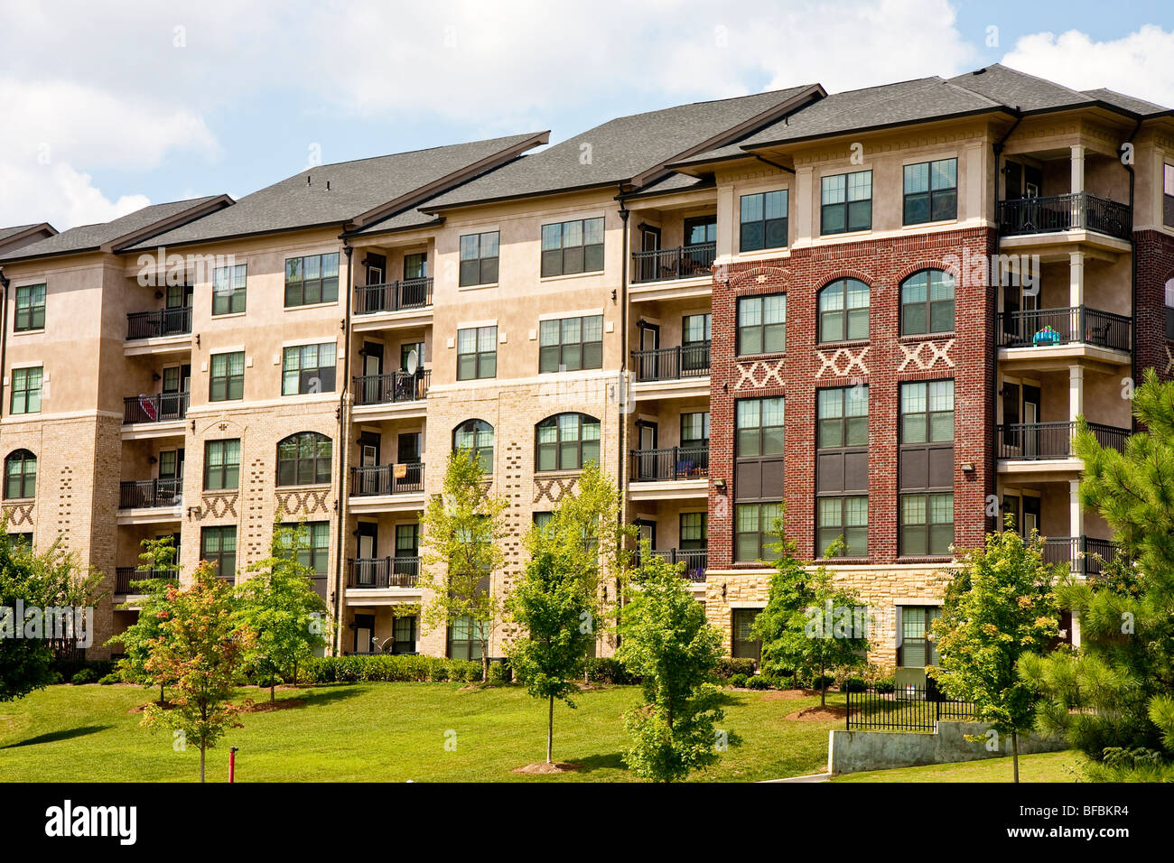 A large modern brick and stucco apartment complex Stock Photo - Alamy