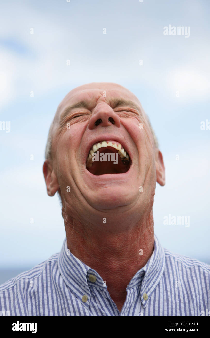 Expressive man laughing Stock Photo - Alamy