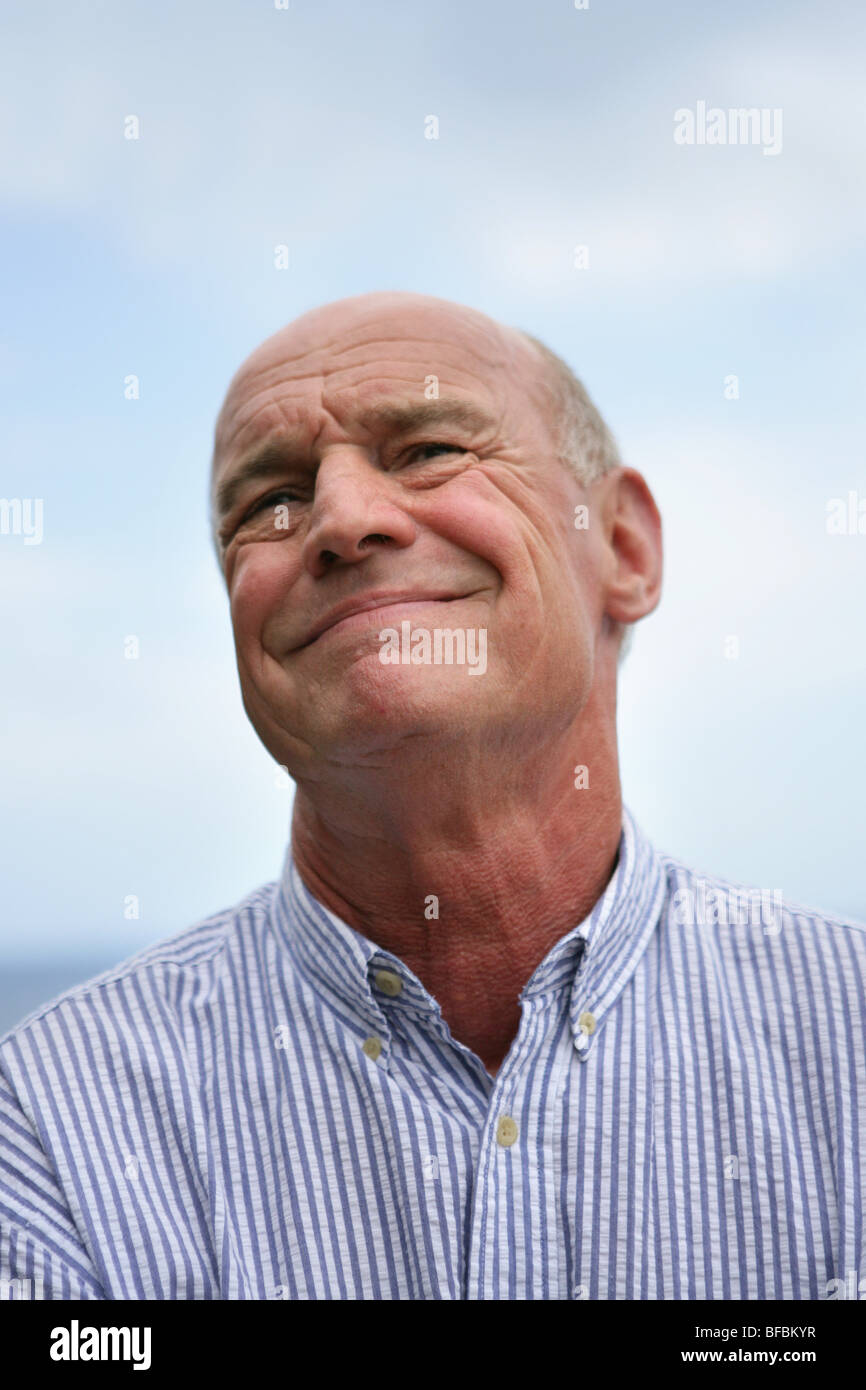 Senior man showing signs of stress Stock Photo - Alamy