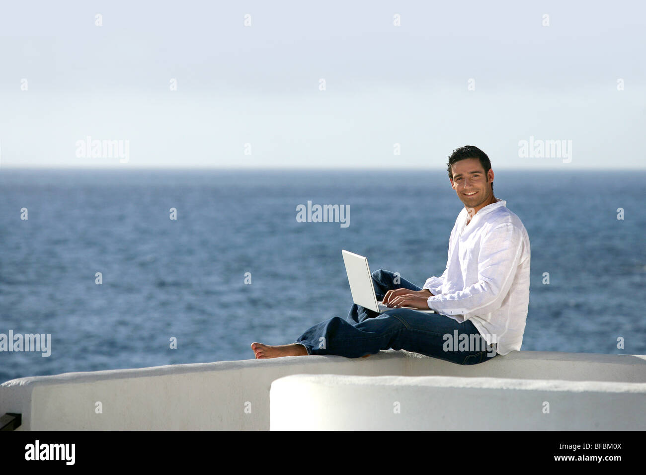 young man working in boat Stock Photo - Alamy