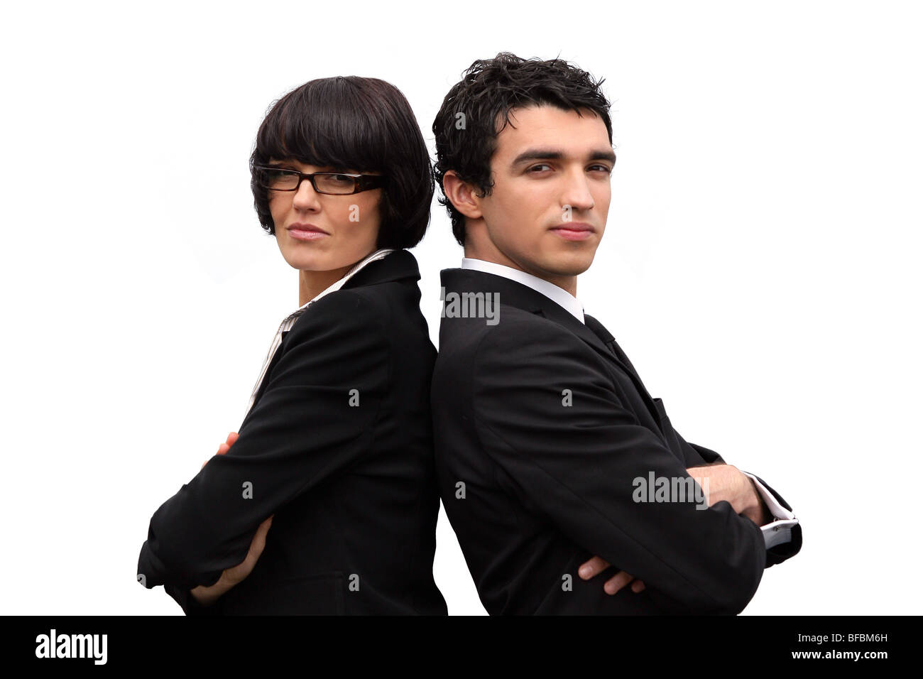 Businesspartners stood back to back Stock Photo - Alamy