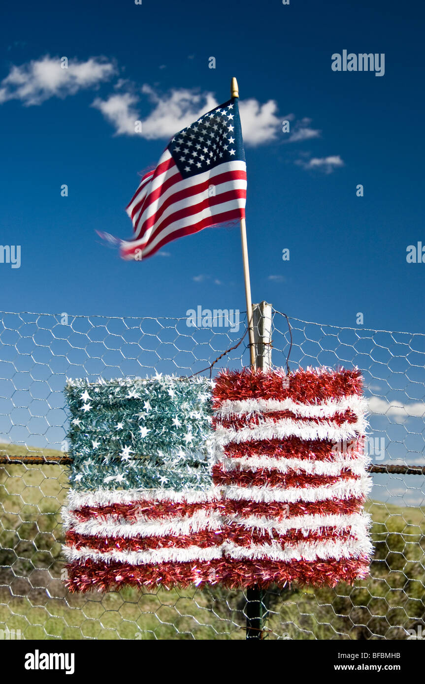 USA Flags attached to a fence Stock Photo - Alamy
