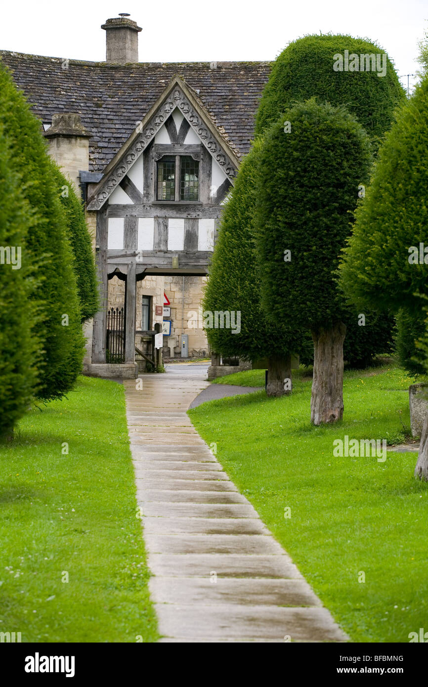 Yew trees leading to the Lychgate in churchyard of St Mary's Church ...