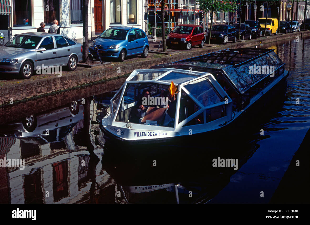 Sightseeing river bus on canal in Delft, Holland Stock Photo - Alamy