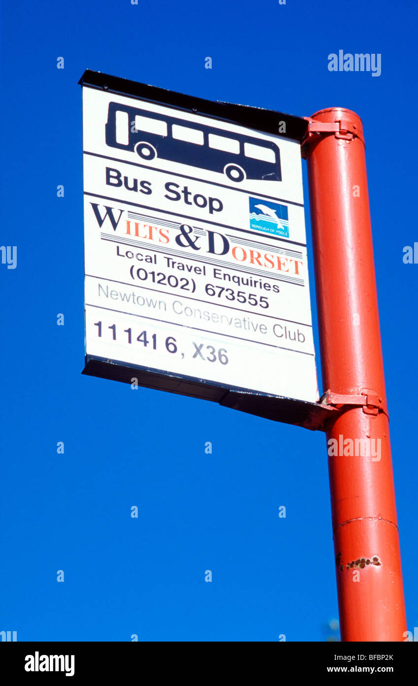 Bus stop sign on red metal post Stock Photo - Alamy