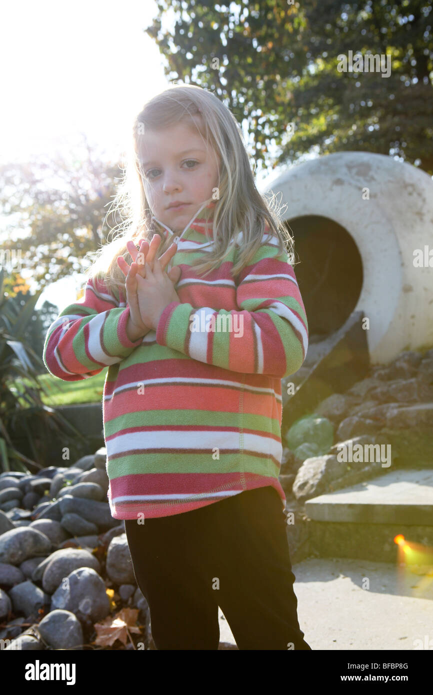 Little girl in strong autumn light sunlight Stock Photo - Alamy
