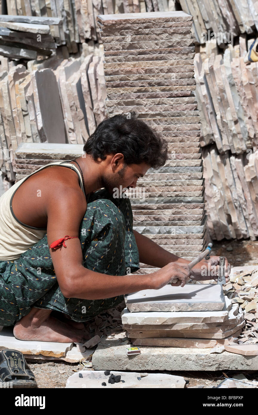 Indian craftsman making marble floor tiles by hand in a street ...