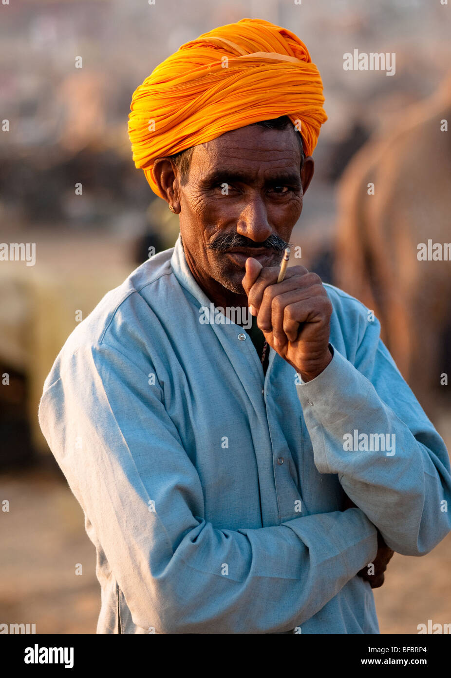One Eyed Man smoking at Pushkar Fair Stock Photo - Alamy