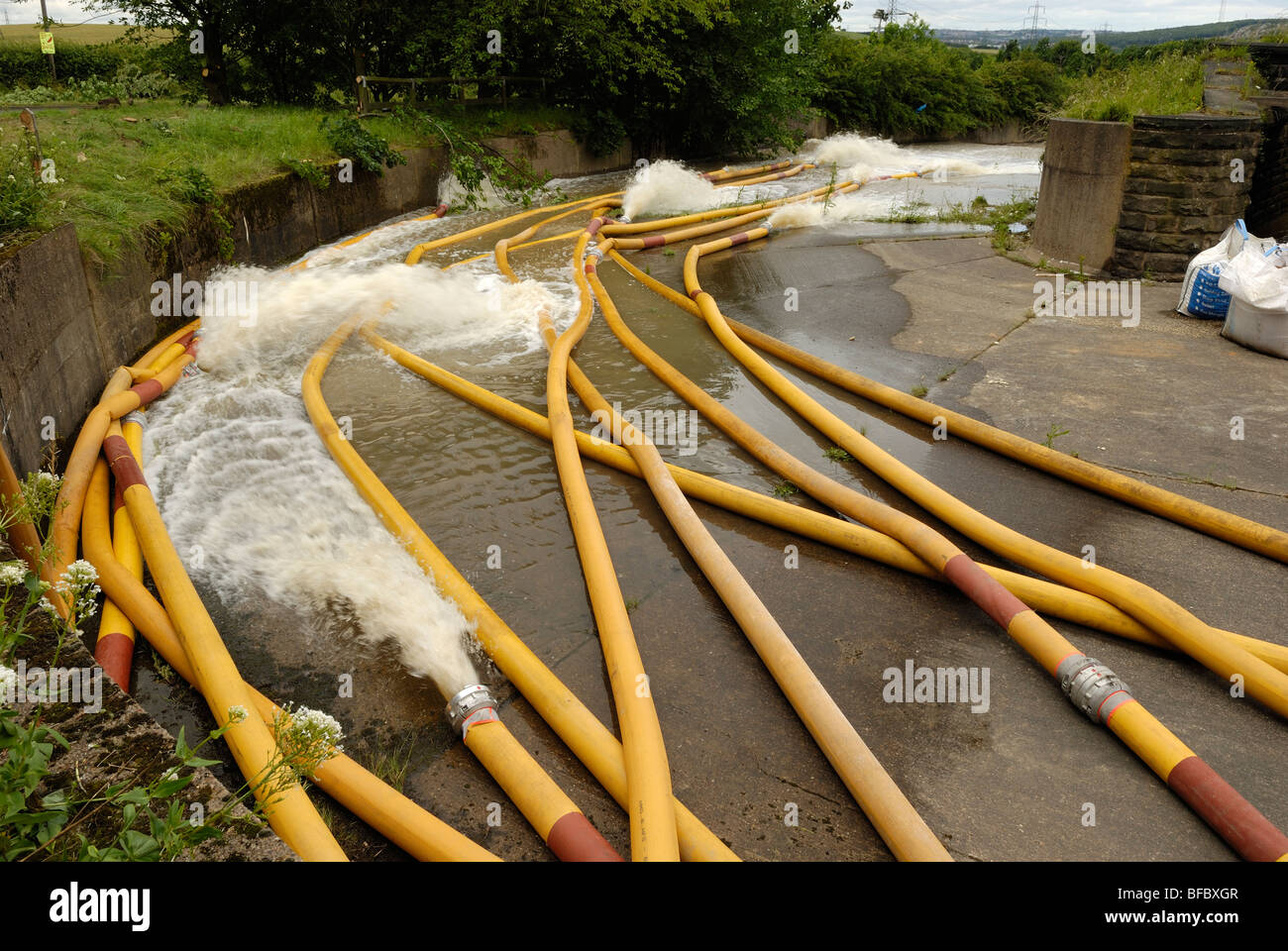 Fire & Rescue Service High Volume pumps and hose used to release flood ...