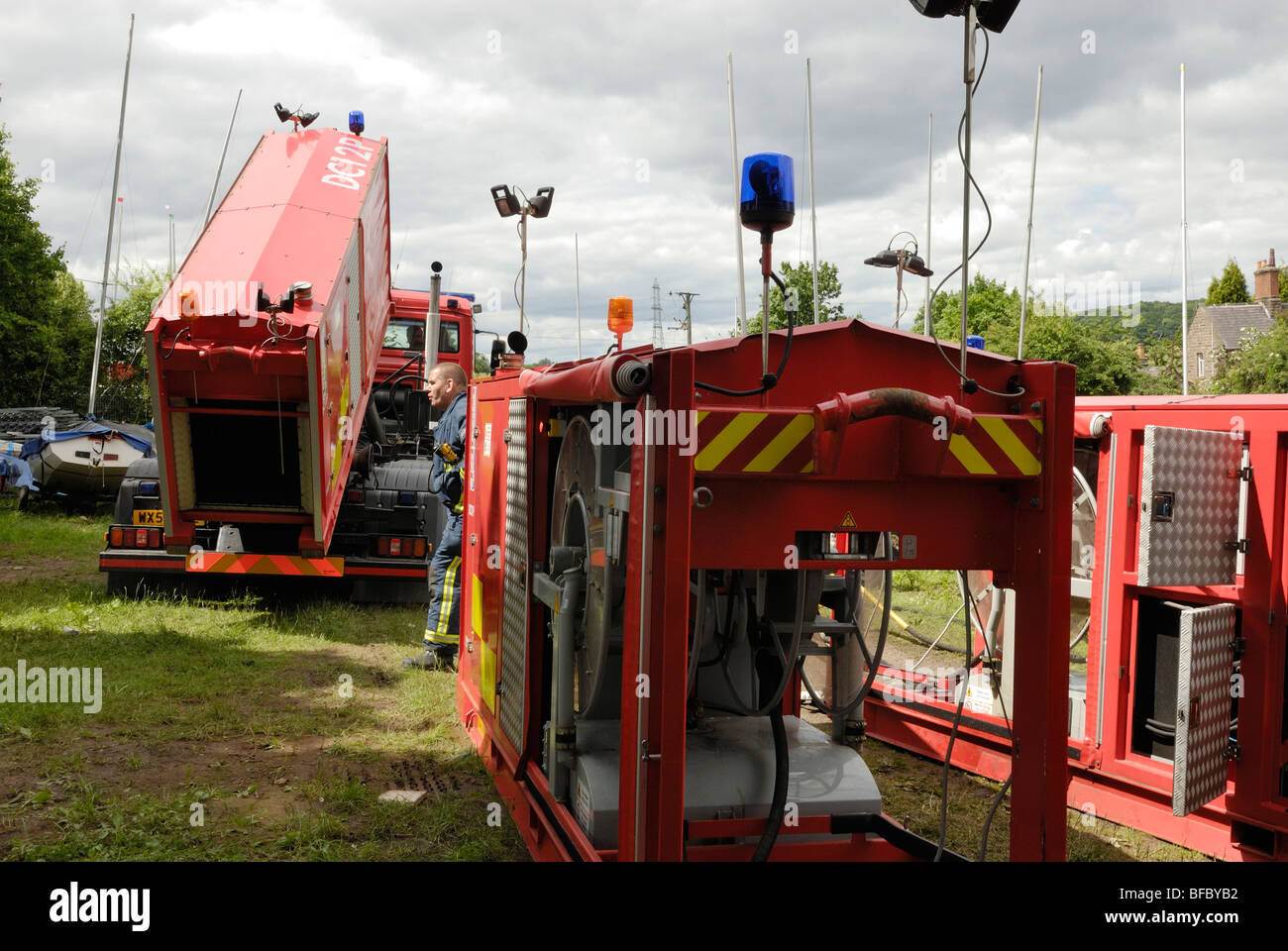 Fire & Rescue Service High Volume pumps and hose used to release flood ...