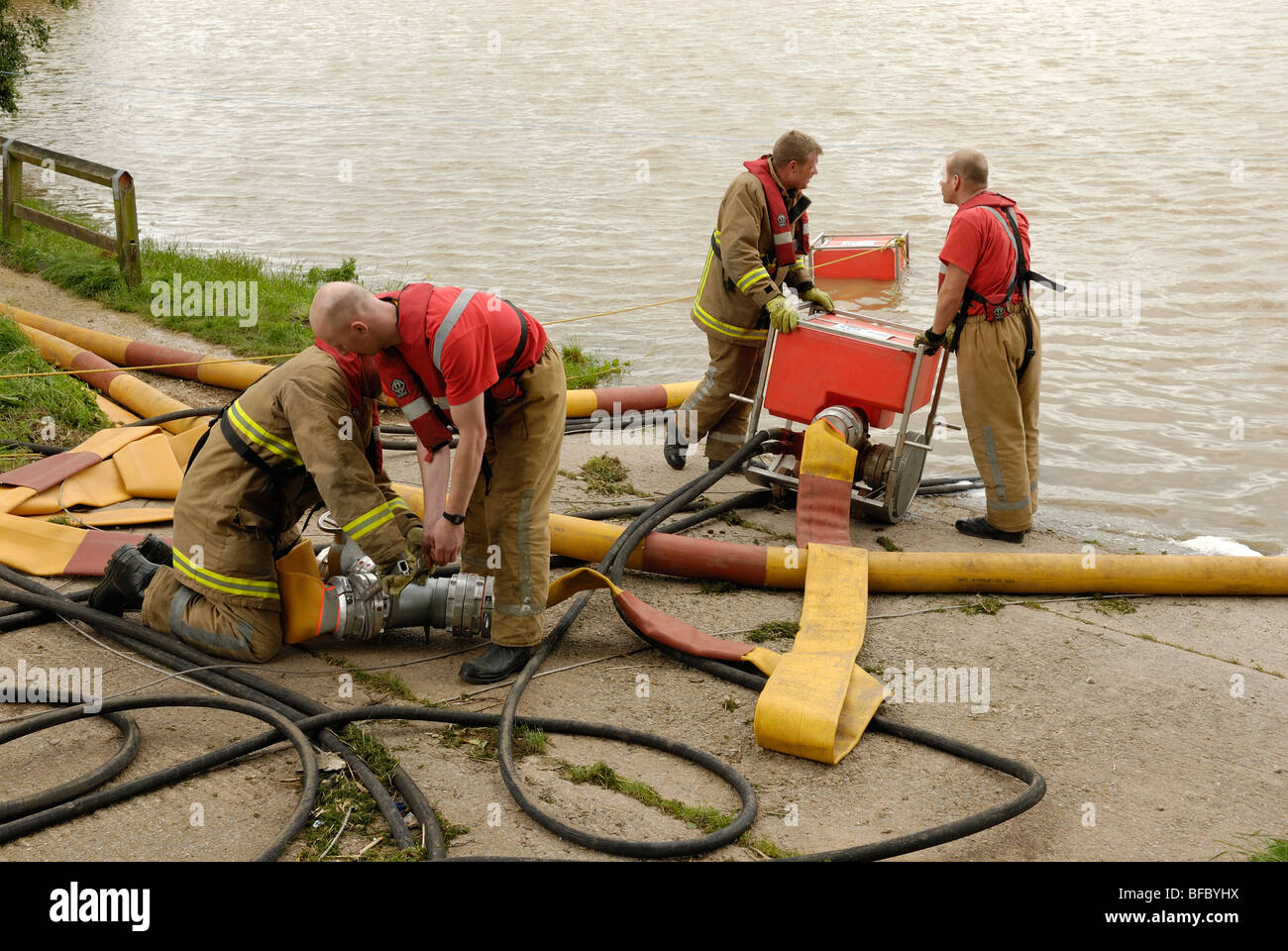Fire & Rescue Service High Volume pumps and hose used to release flood ...