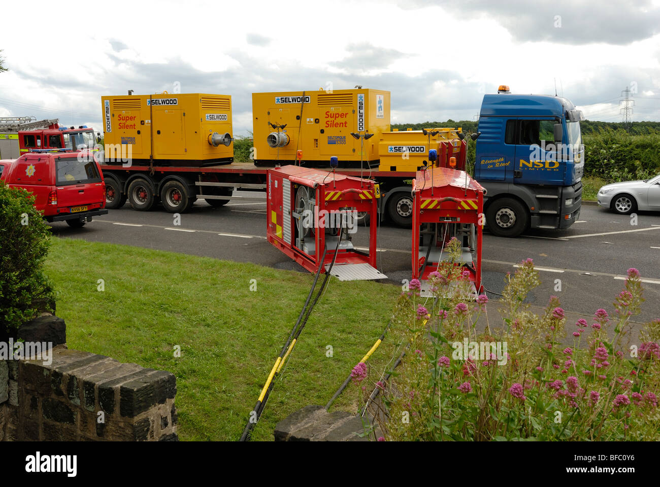Fire & Rescue Service High Volume pumps and hose used to release flood ...