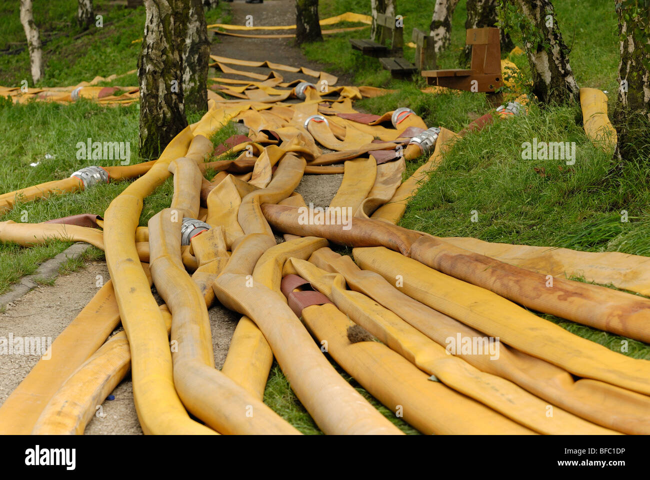 Fire & Rescue Service High Volume pumps and hose used to release flood ...