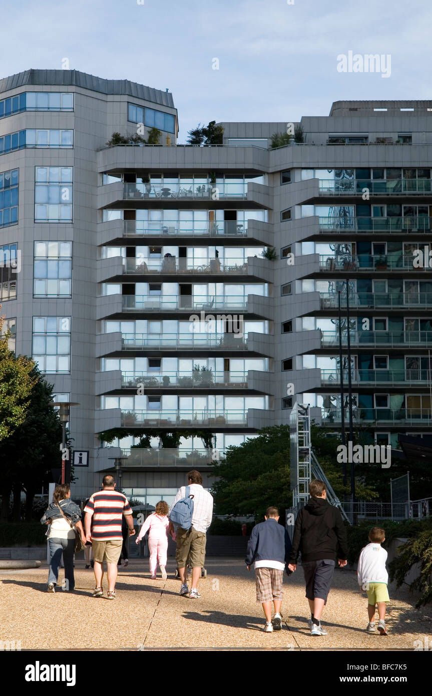 Adults and children walking back home Stock Photo - Alamy