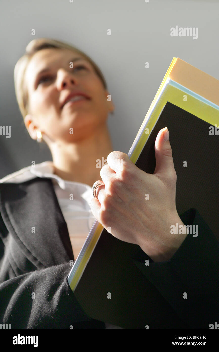 young woman carrying folders Stock Photo - Alamy young woman carrying folders Stock Photo - Alamy