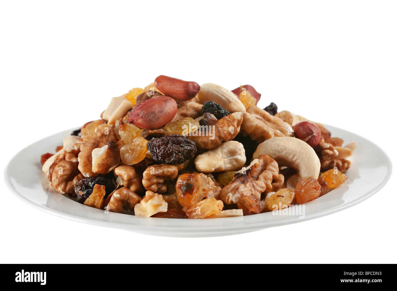 Mix dry raisin and nut in white plate Stock Photo - Alamy
