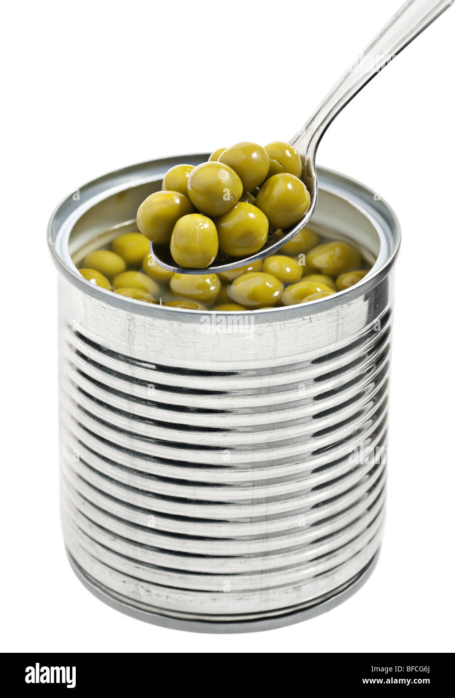 Preserved peas vegetable in metal spoon closeup Stock Photo - Alamy