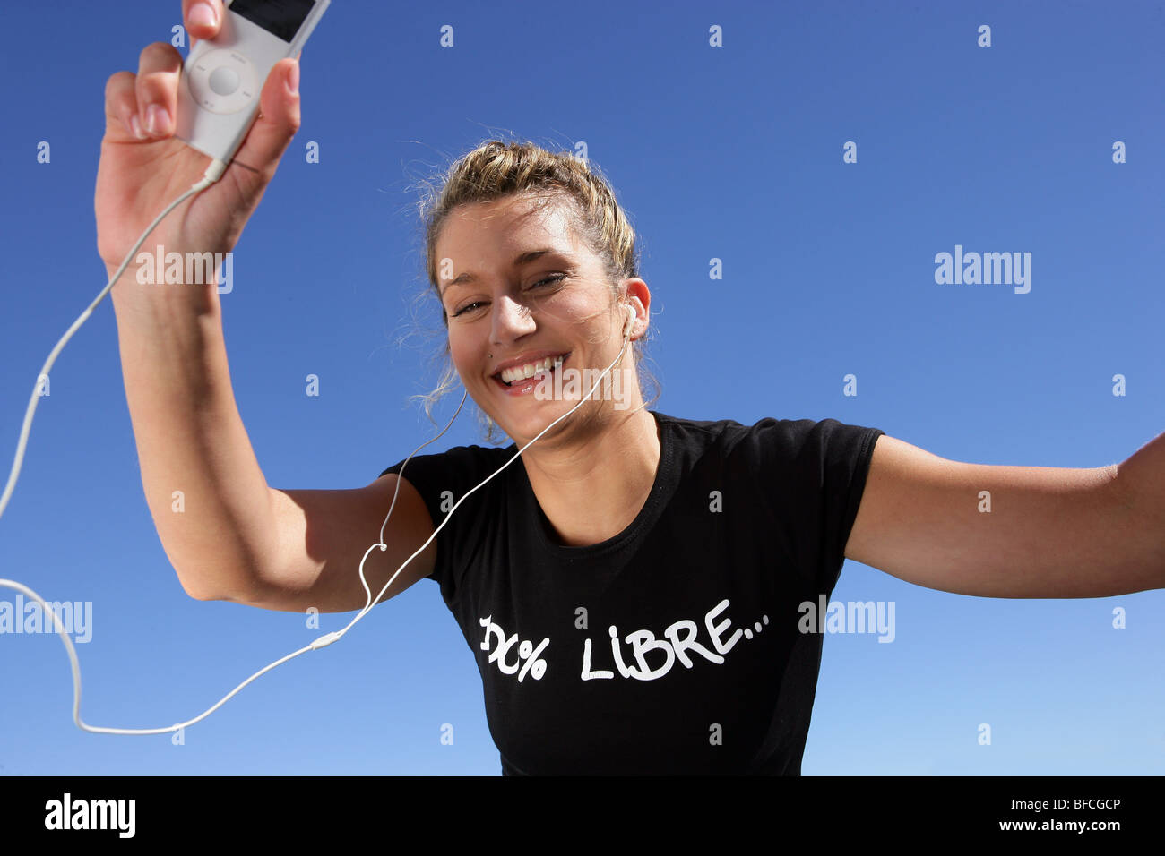Woman with music player Stock Photo - Alamy