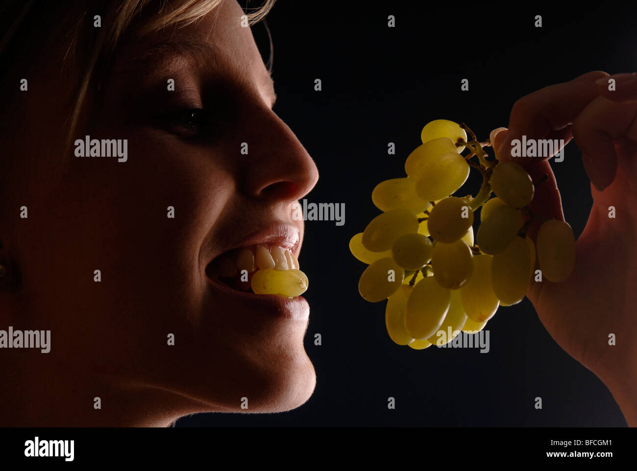 Bite the grape hi-res stock photography and images - Alamy