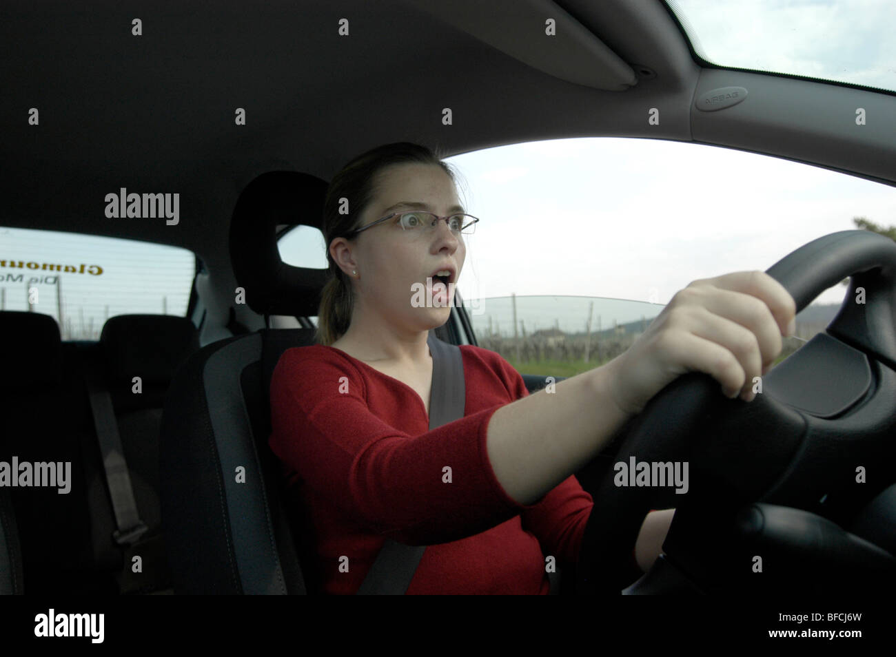 female driver is shocked Stock Photo - Alamy