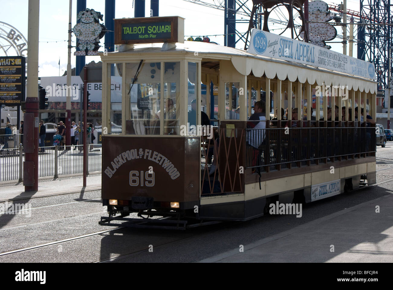Tram running on Blackpool's Golden Mile with the Pleasure Beach in the ...