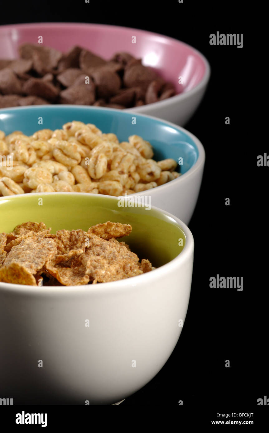 Three colorful bowls with breakfast cereals Stock Photo - Alamy
