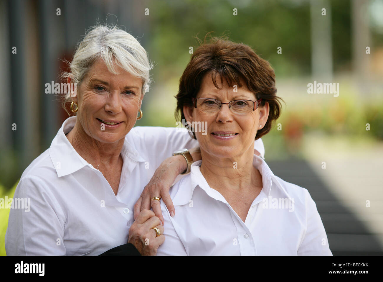 Two older women standing outside Stock Photo - Alamy