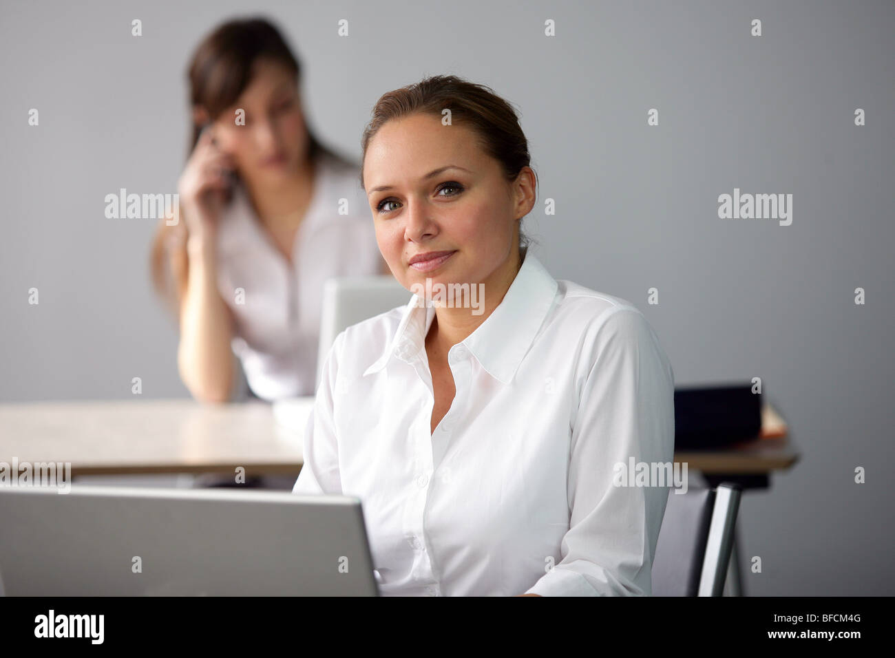 Pretty employee at her desk Stock Photo - Alamy