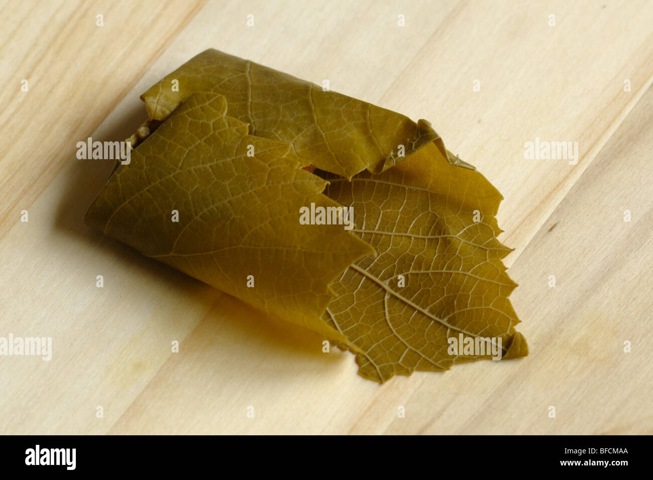 Preparation of sarma (dolmadakia) - grape leaves stuffed with rice ...