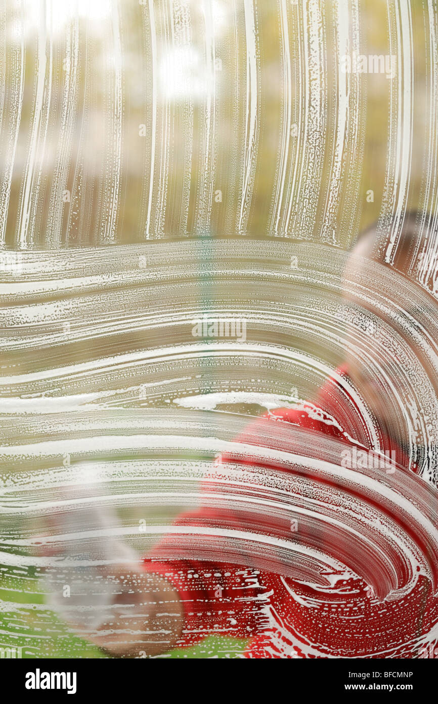 Man washing window with a sponge Stock Photo - Alamy