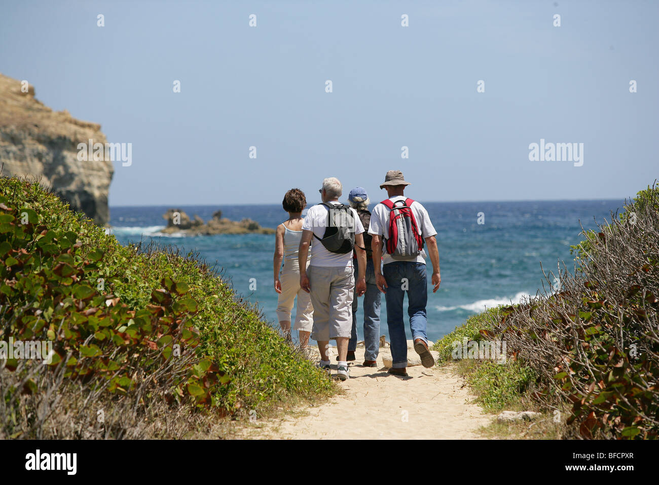 Group of ramblers on the coast Stock Photo - Alamy